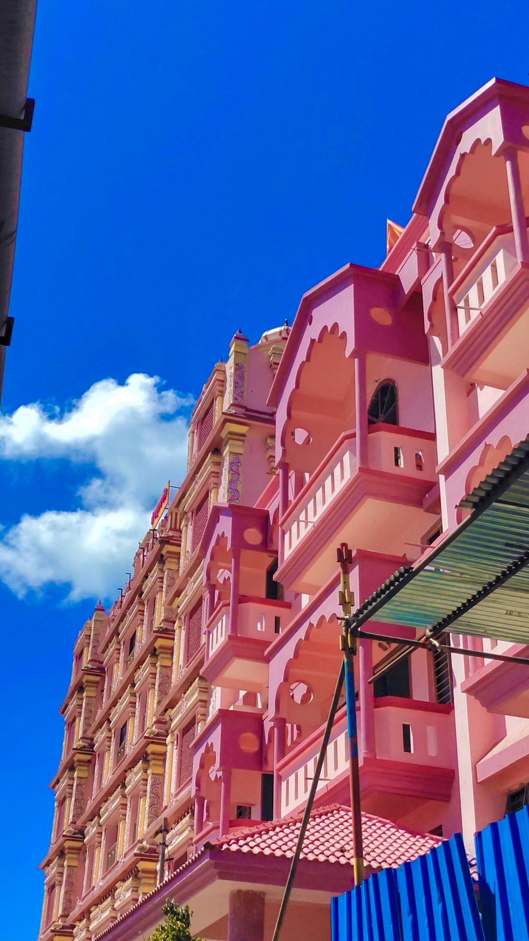 A stunning pink architectural marvel against a vivid blue sk
