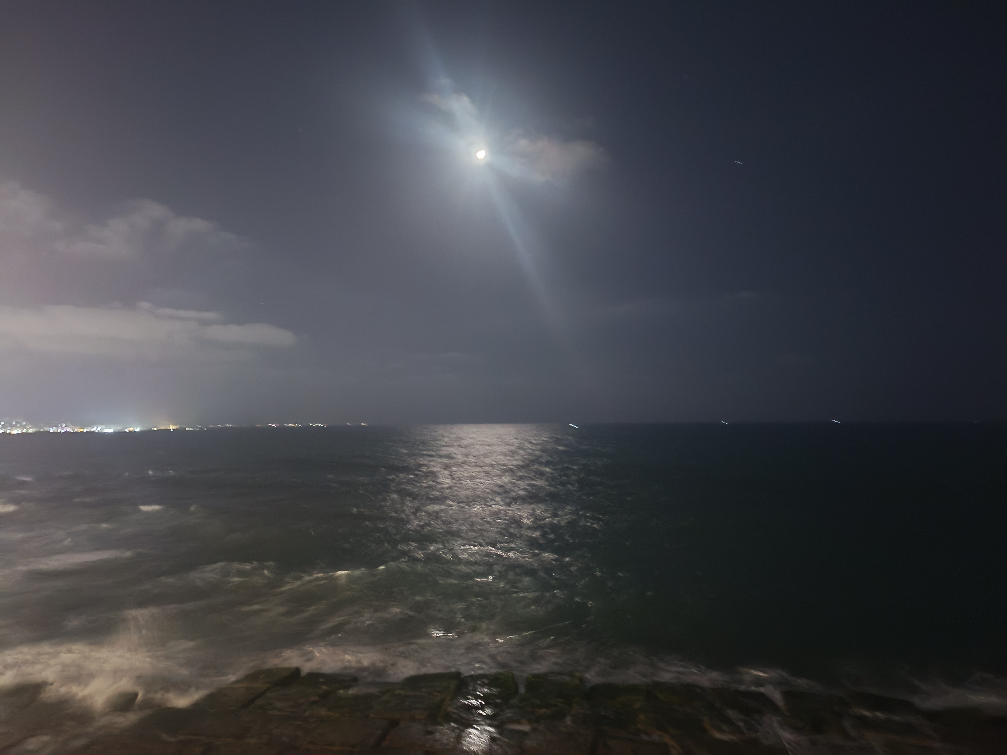 It's very nice view with the moon on the sea