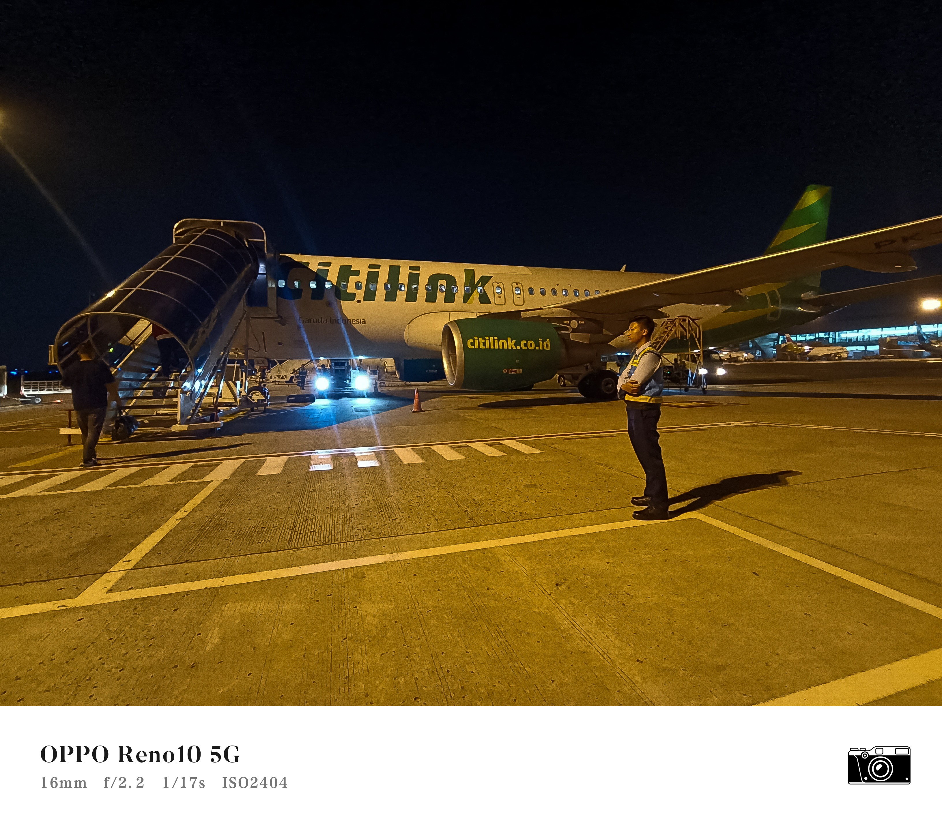 As night falls, the airport comes alive. Passengers board un