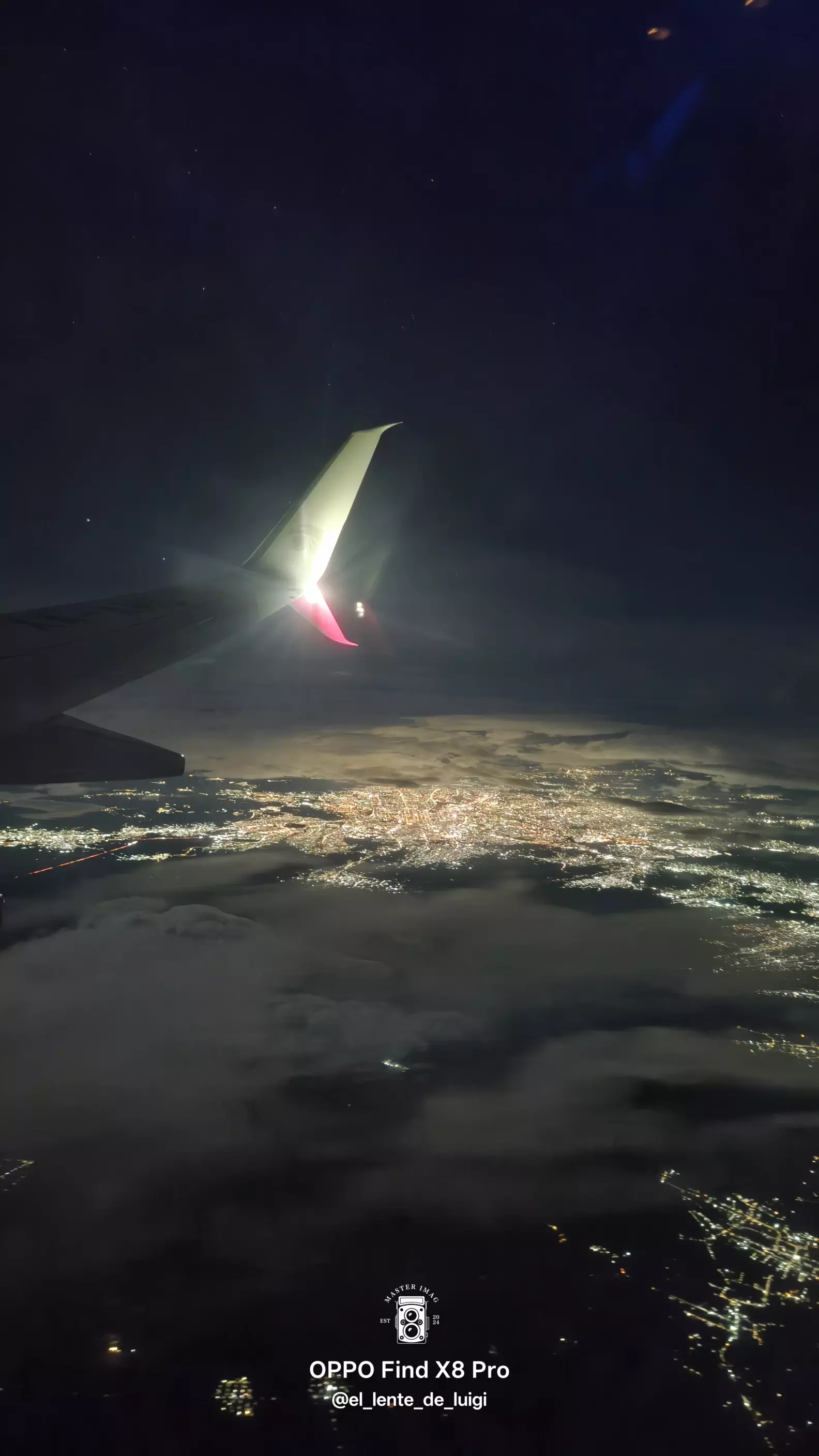 At over 10,000 meters high, the city lights pulse beneath a