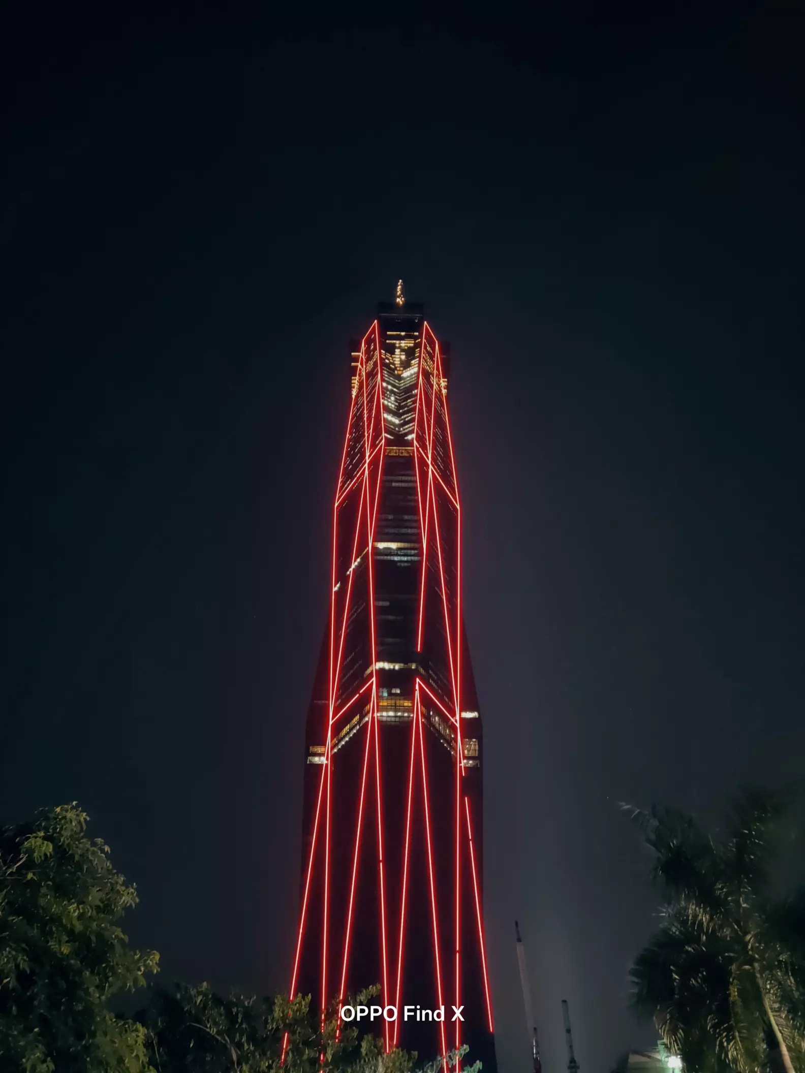 Behold Merdeka 118, a majestic skyscraper piercing the night