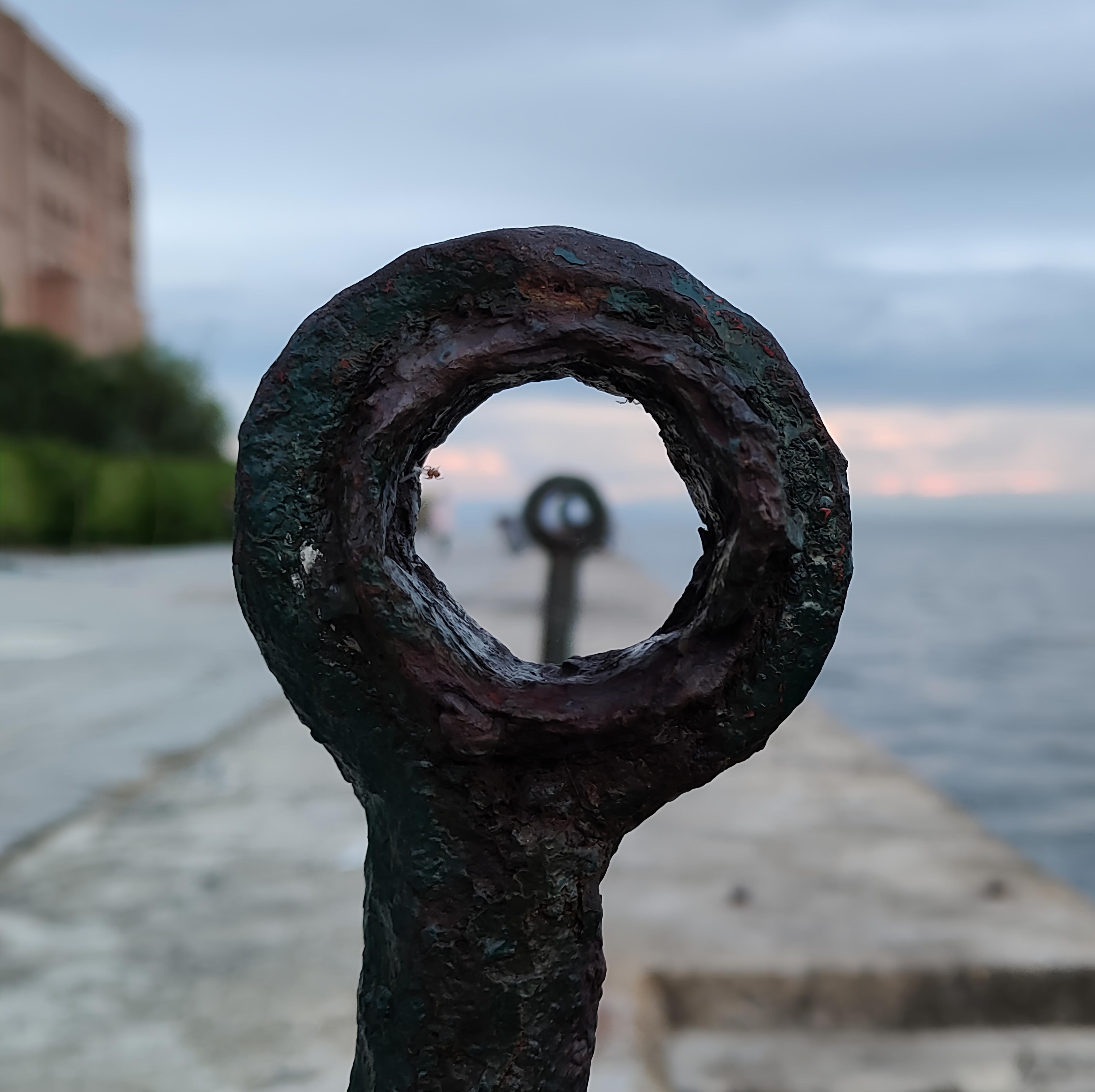Through the Ring of TimeA ring of iron, weathered, worn, Anc