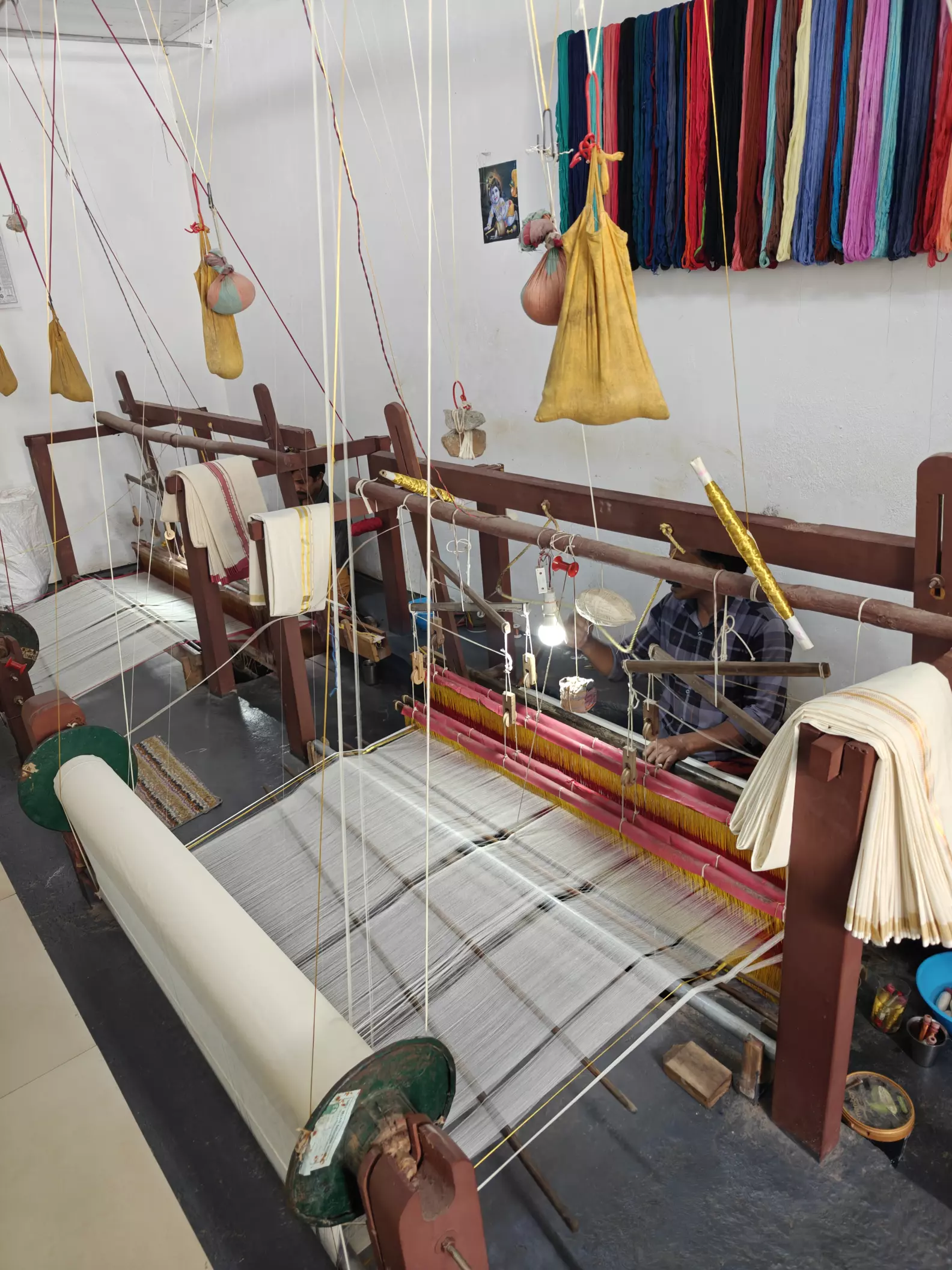 This is a traditional saree-weaving workshop in Kerala. Kera